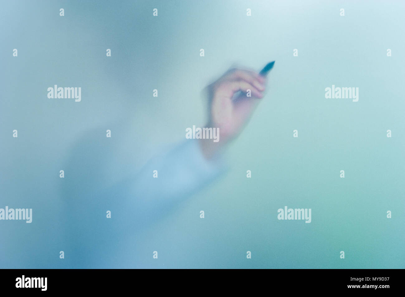 hand writing on blurred glass wall, abstract background with space ...