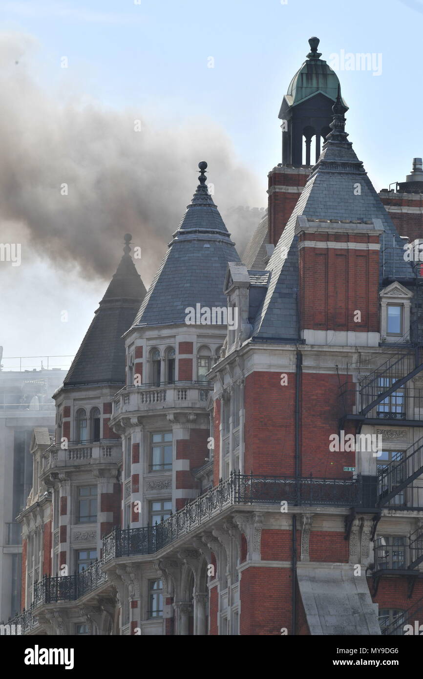 Smoke rising from a building in Knightsbridge, central London, as ...