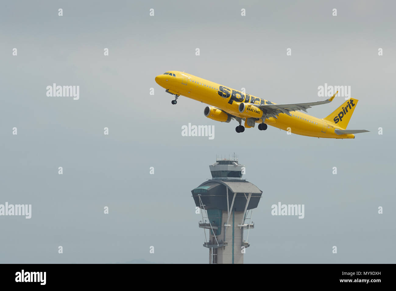 Vivid Yellow Spirit Airlines Airbus A321 Jet Airliner Taking Off From ...