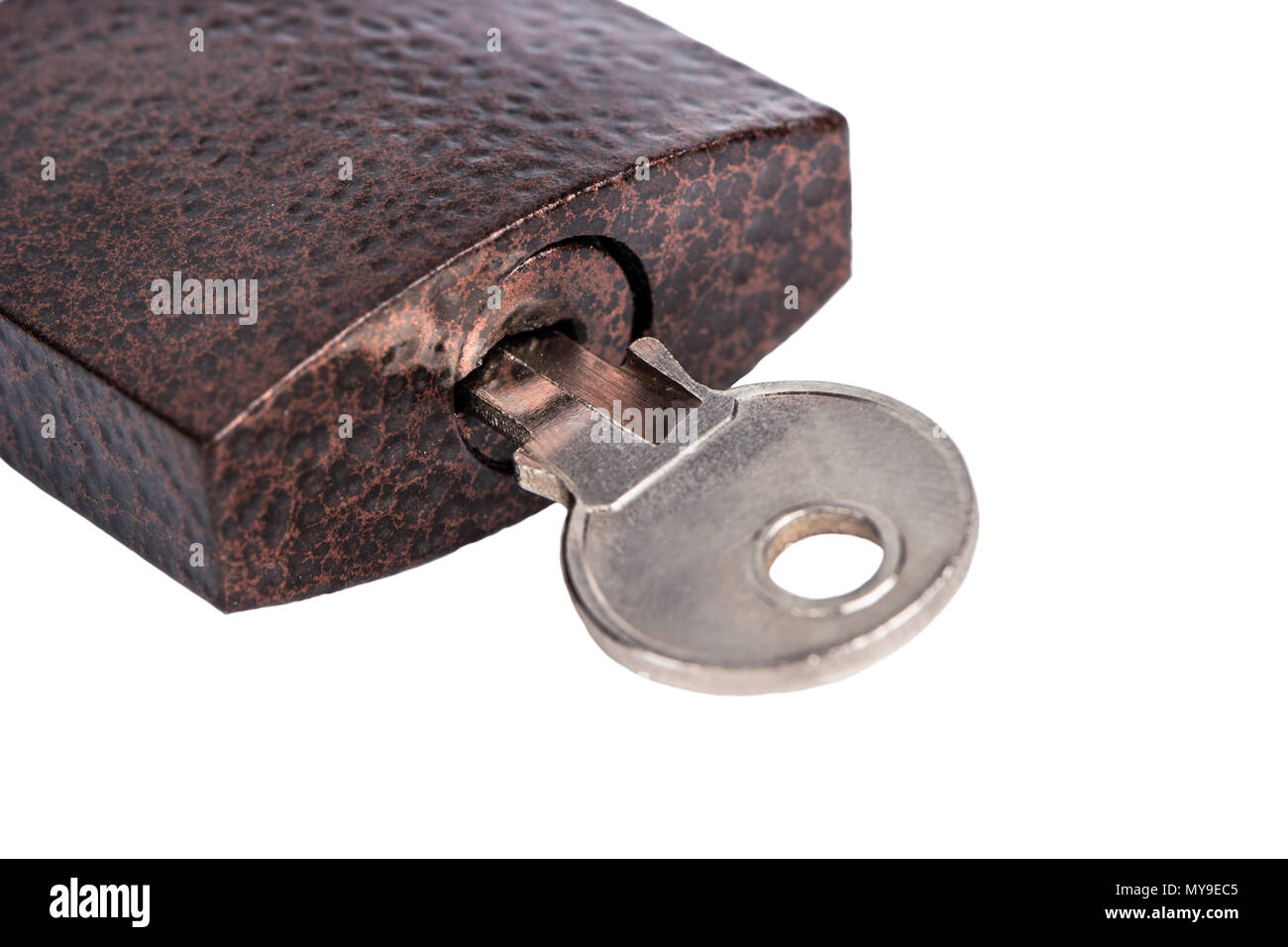 The key in the keyhole close-up on a white background Stock Photo - Alamy