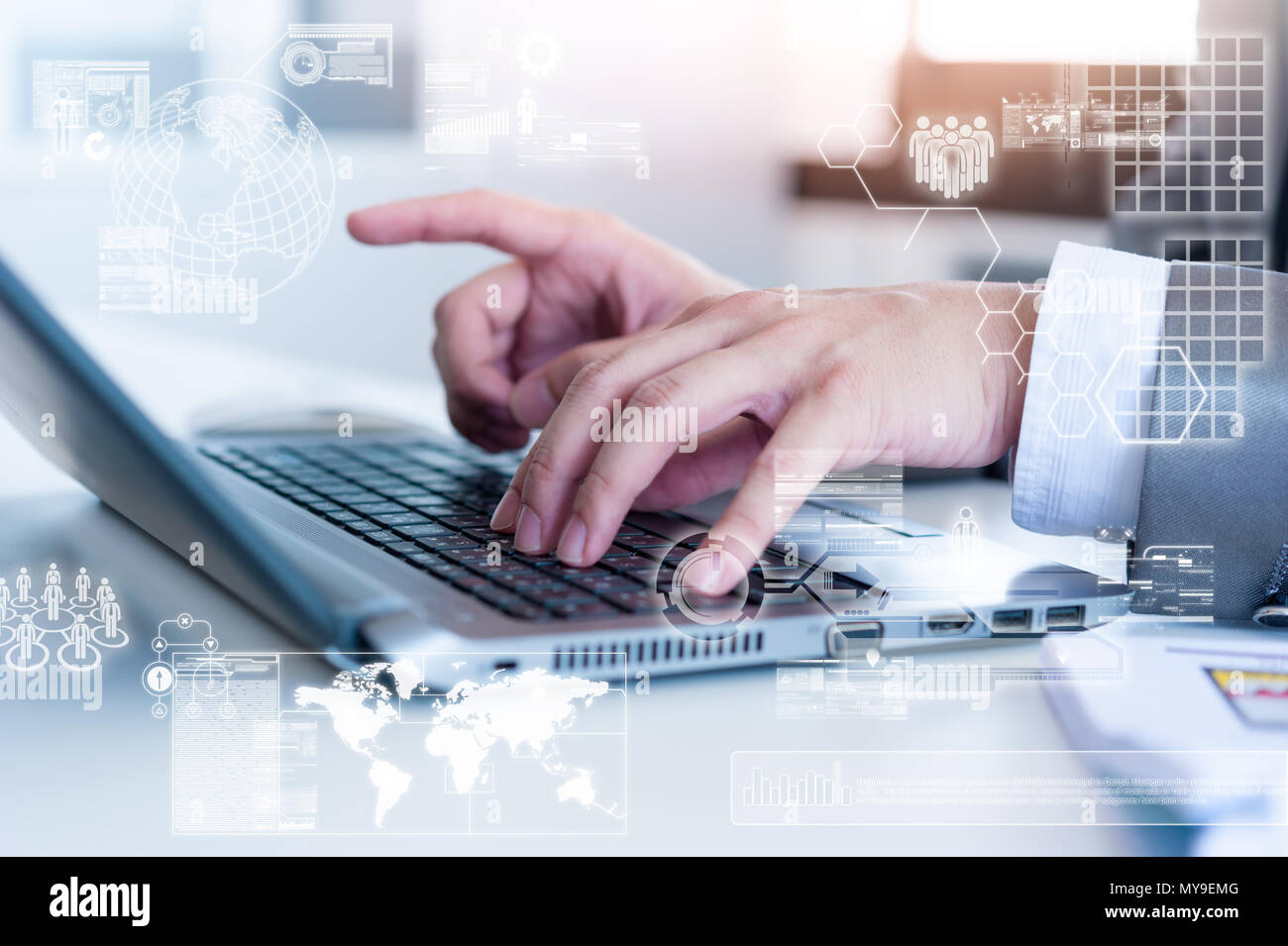 Close up of business man typing on laptop conputer with technology ...