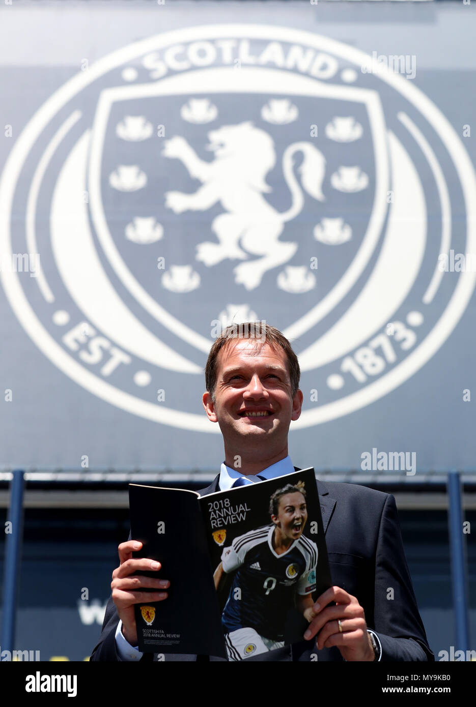 Scottish FA Chief Executive Ian Maxwell holds a copy of the report ...