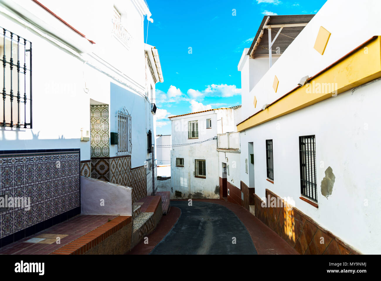 beautiful, picturesque street, narrow road, white facades of buildings ...