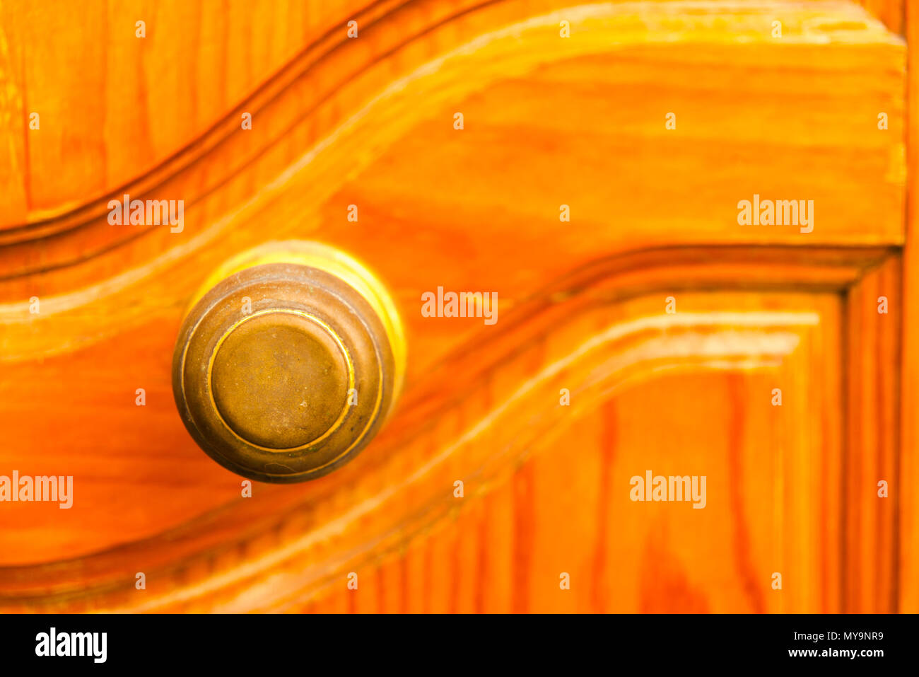 close up on a round door handle with decorative elements, door ...