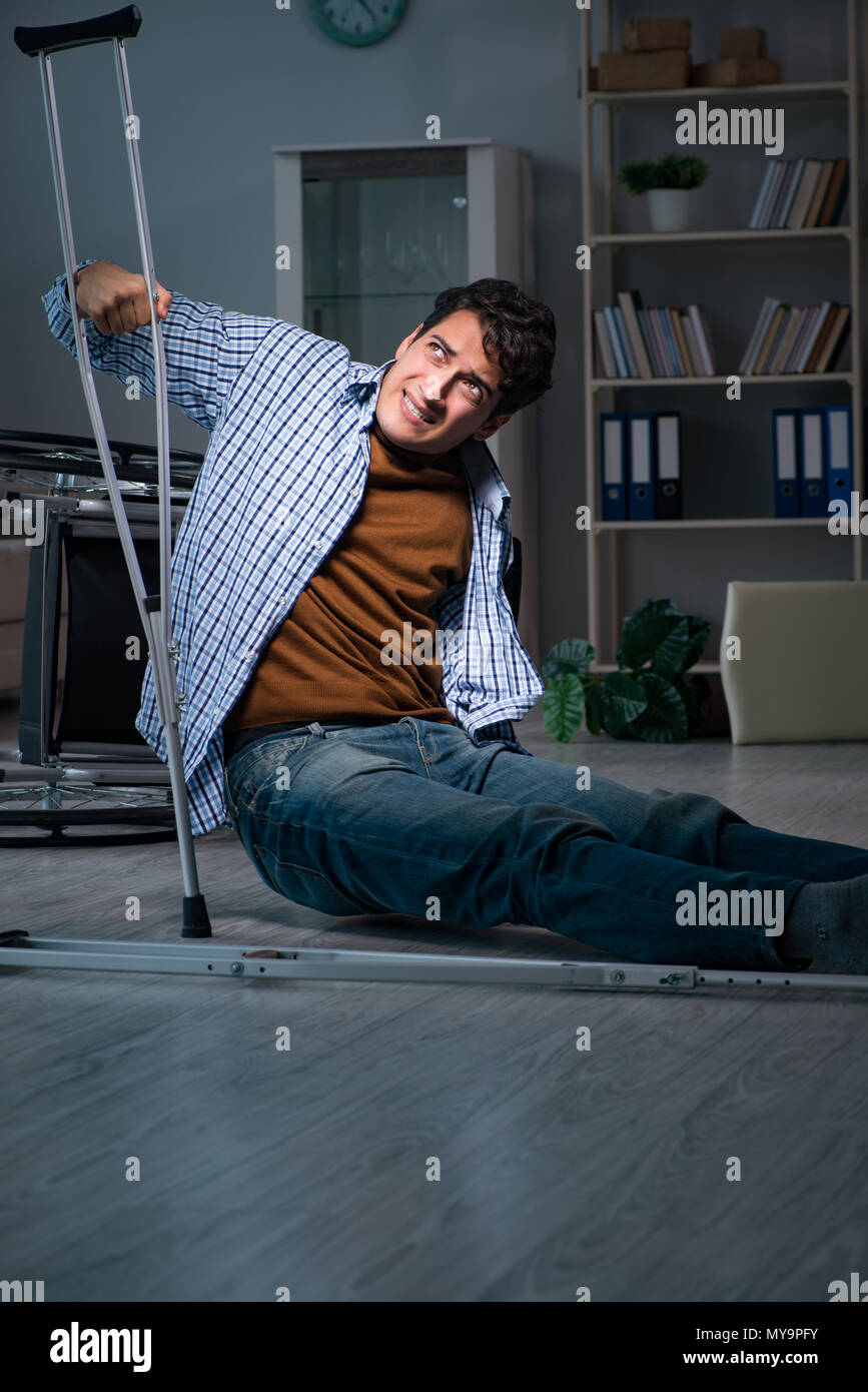 Man fell off wheelchair sitting on the floor Stock Photo - Alamy