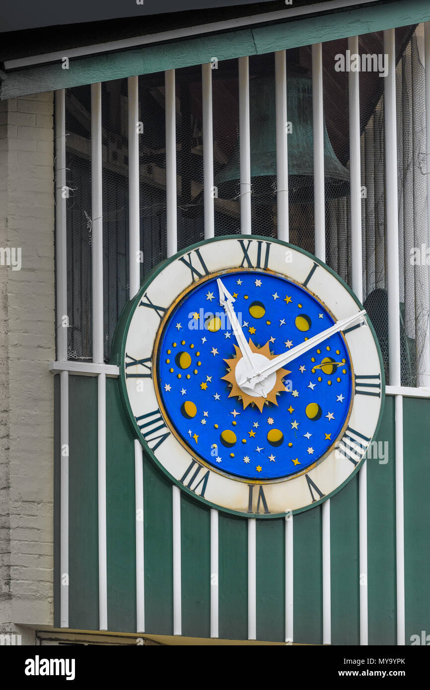 Clock and bell on a wall in the Corporation street shopping centre at ...