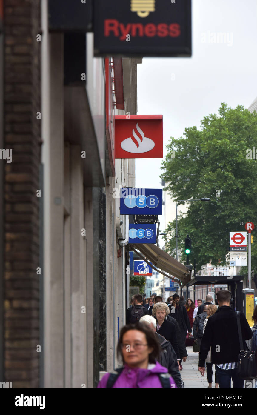 People walk past the bank branches of the TSB, Santander and Nationwide ...
