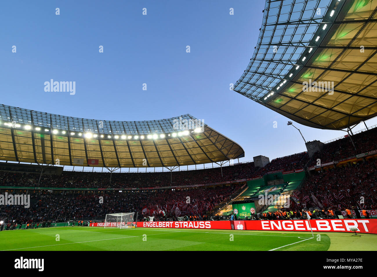 Football stadium illuminated with perimeter advertising, blue hour, DFB ...