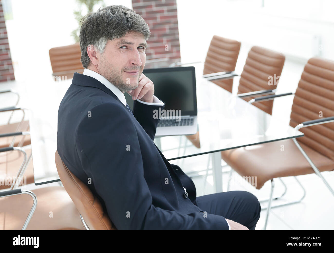 Boss sitting in the workplace before the meeting Stock Photo - Alamy