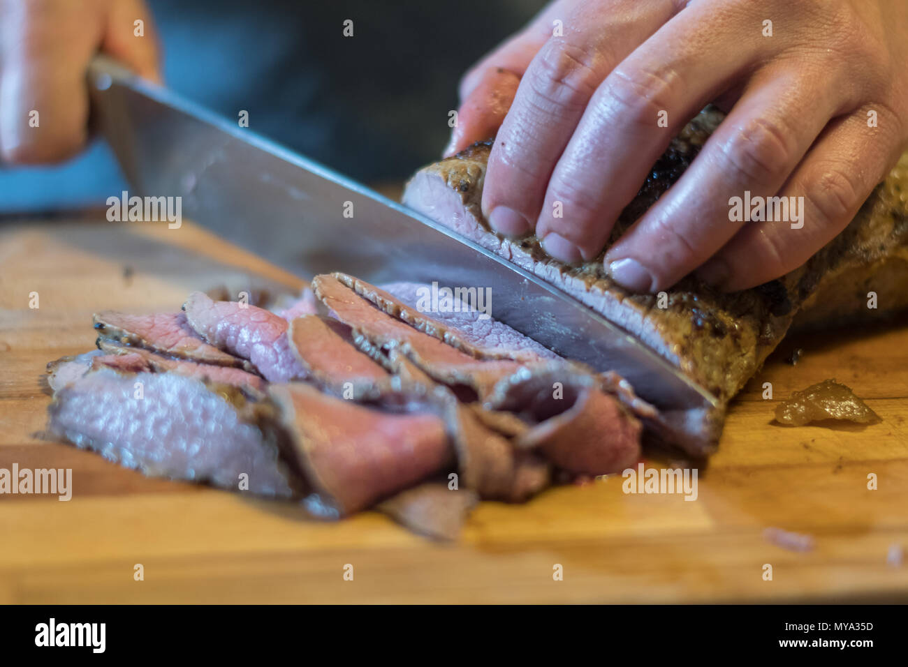 Cutting a fresh meat loaf Stock Photo - Alamy