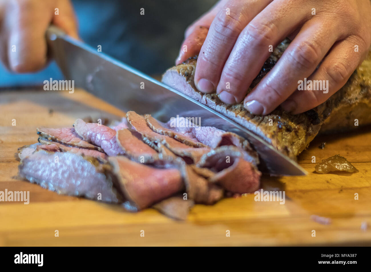 Butcher cutting chicken hi-res stock photography and images - Alamy