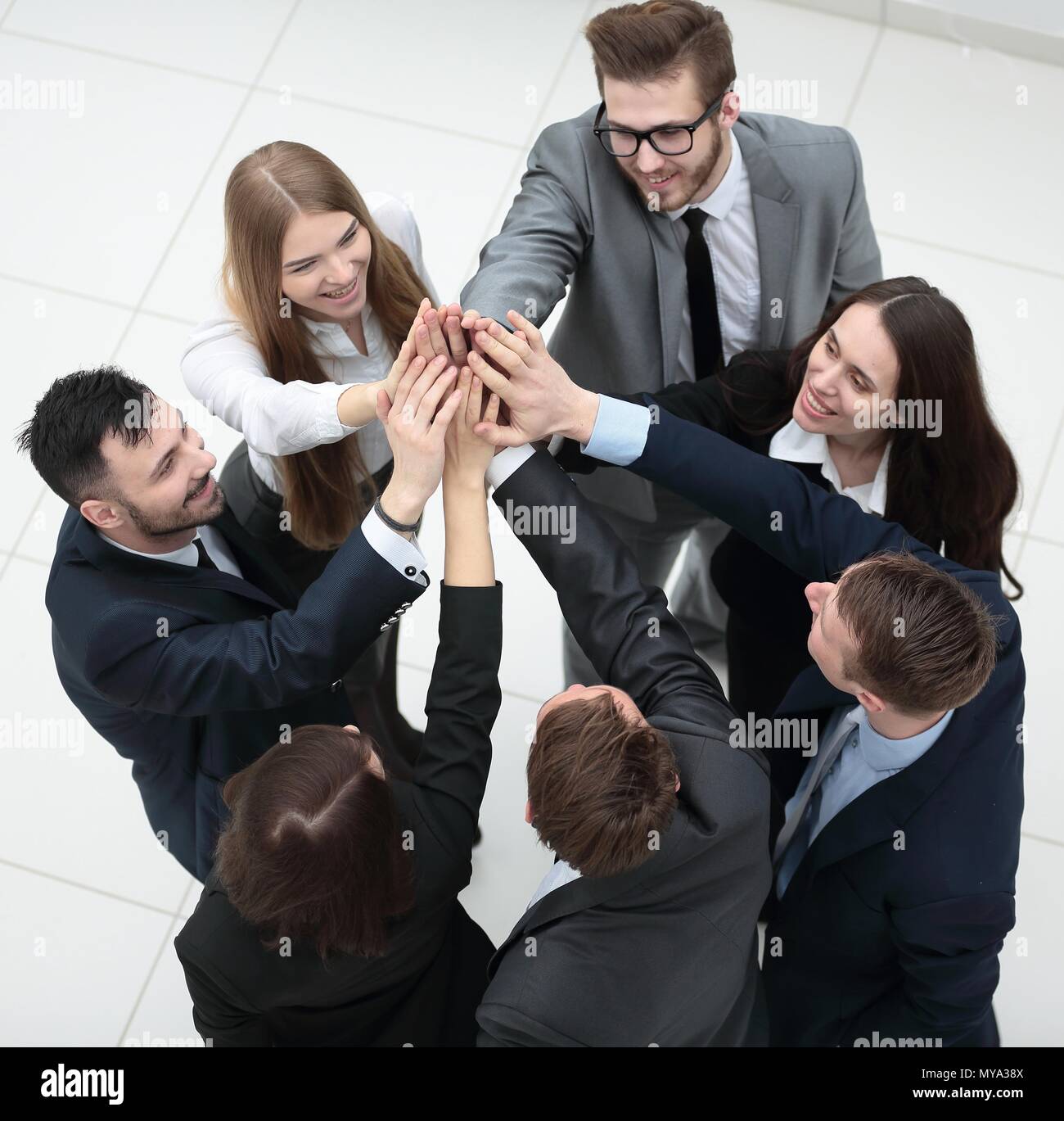 closeup. joyful business team with folded hands together Stock Photo ...