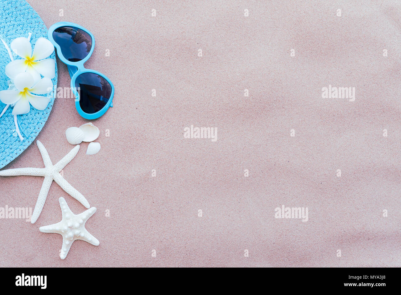 Beach accessories including blue sunglasses, starfish, flower and blue ...