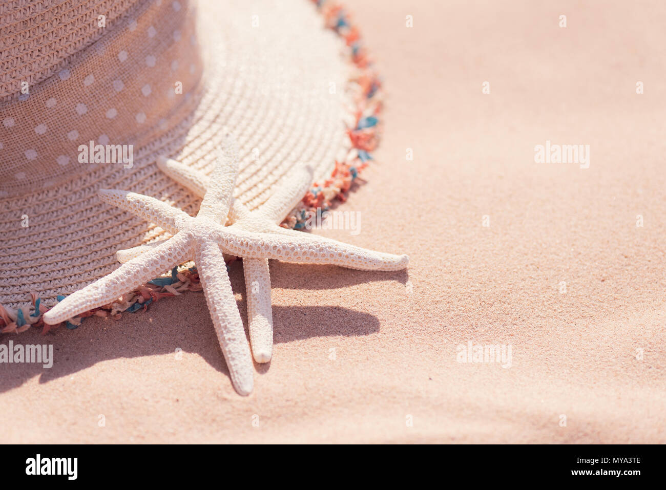 Beach accessories including starfish and hat beach on Sandy beach ...