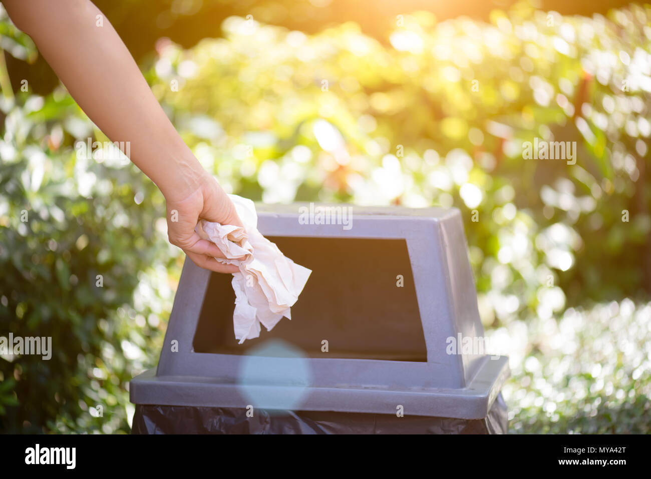 World Environment Day, June 5. Woman hand holding and putting tissue ...