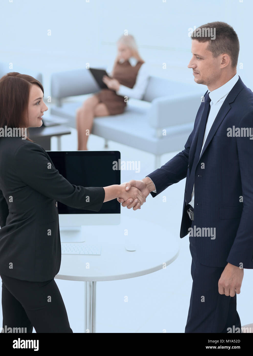 handshake business partners at the negotiating table Stock Photo - Alamy