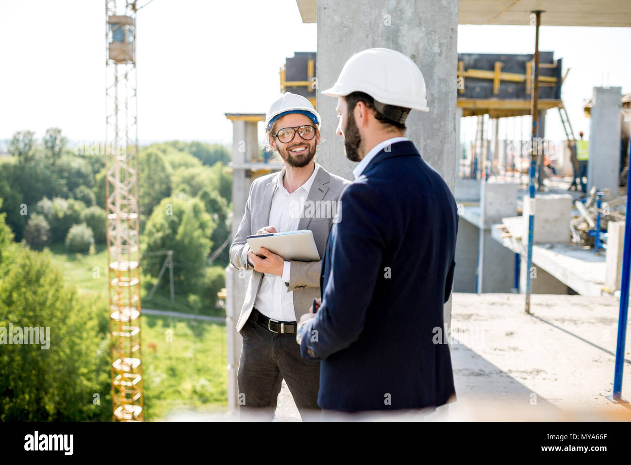 Supervising the process of house construction Stock Photo - Alamy