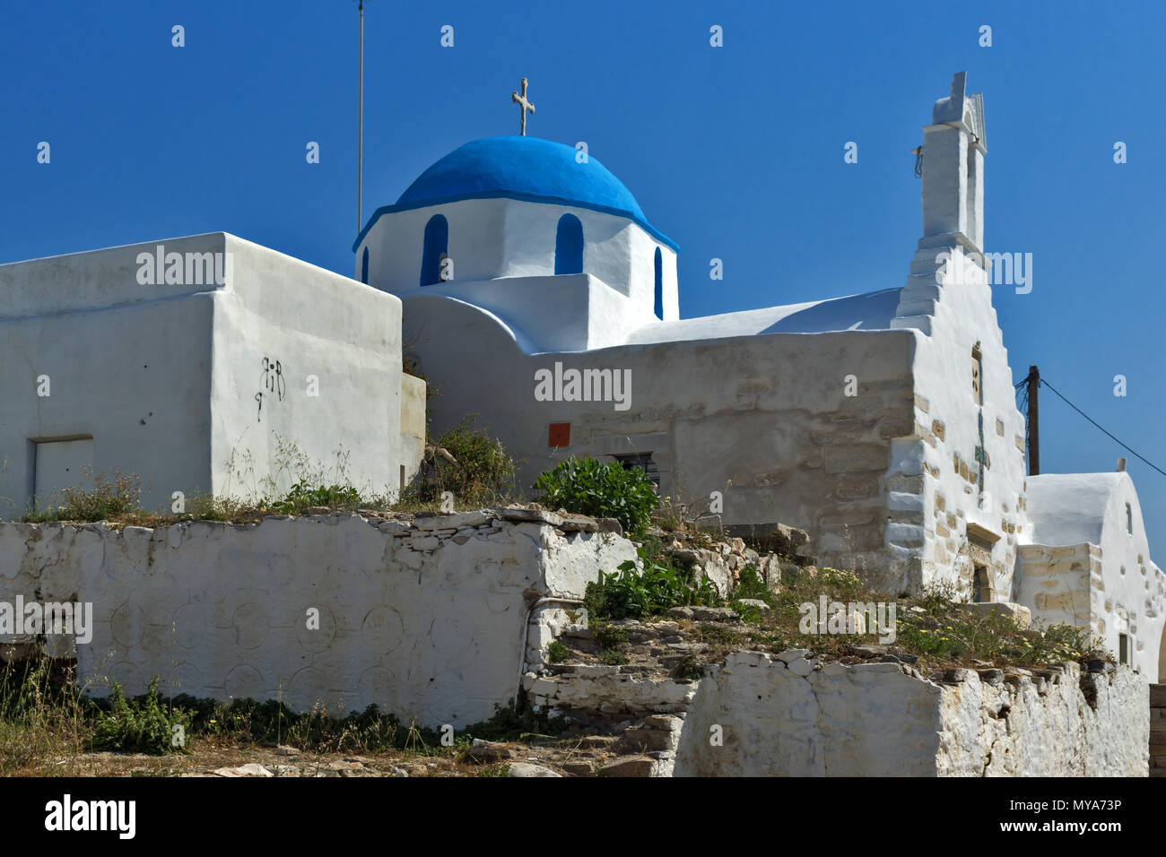 White chuch with blue roof in town of Parakia, Paros island, Cyclades ...