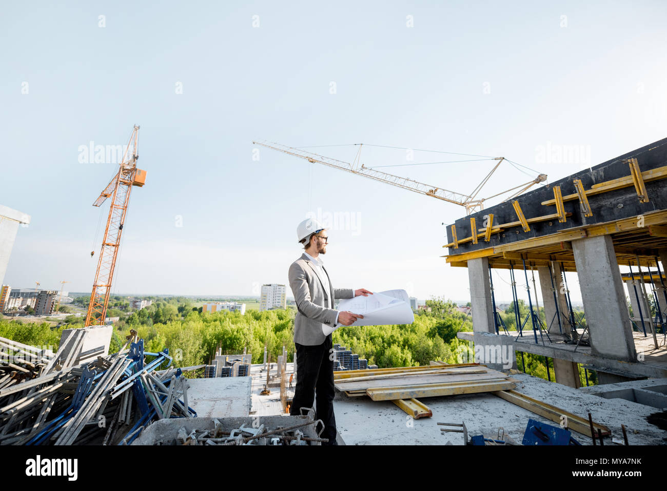 Man with house drawings on the structure Stock Photo - Alamy