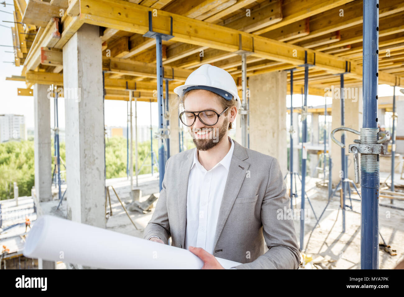 Man with house drawings on the structure Stock Photo - Alamy