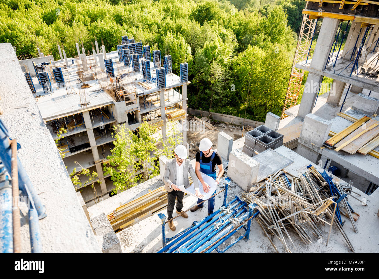 Construction site with workers Stock Photo - Alamy