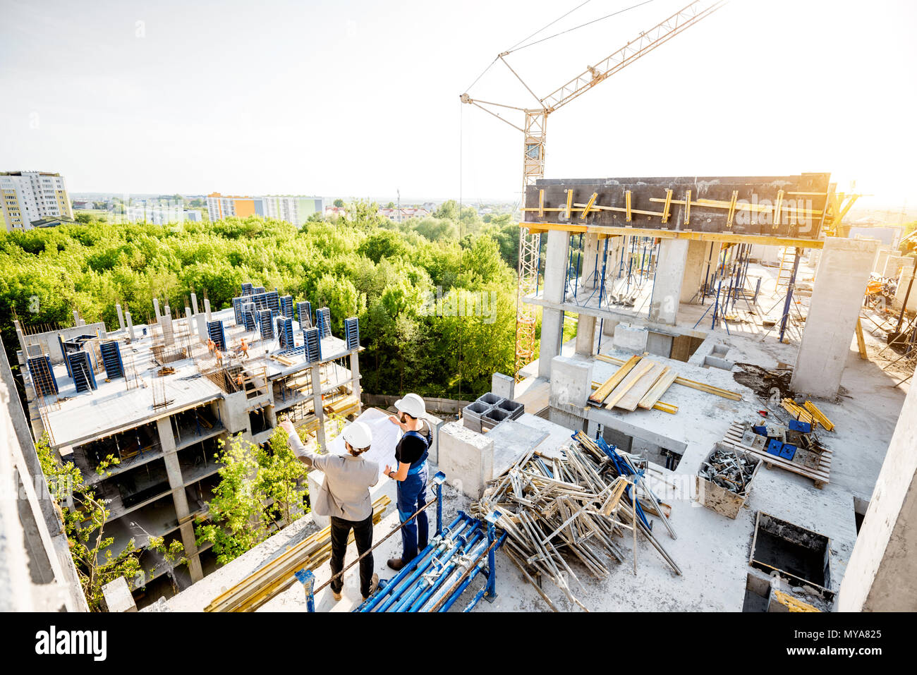 Construction site with workers Stock Photo - Alamy