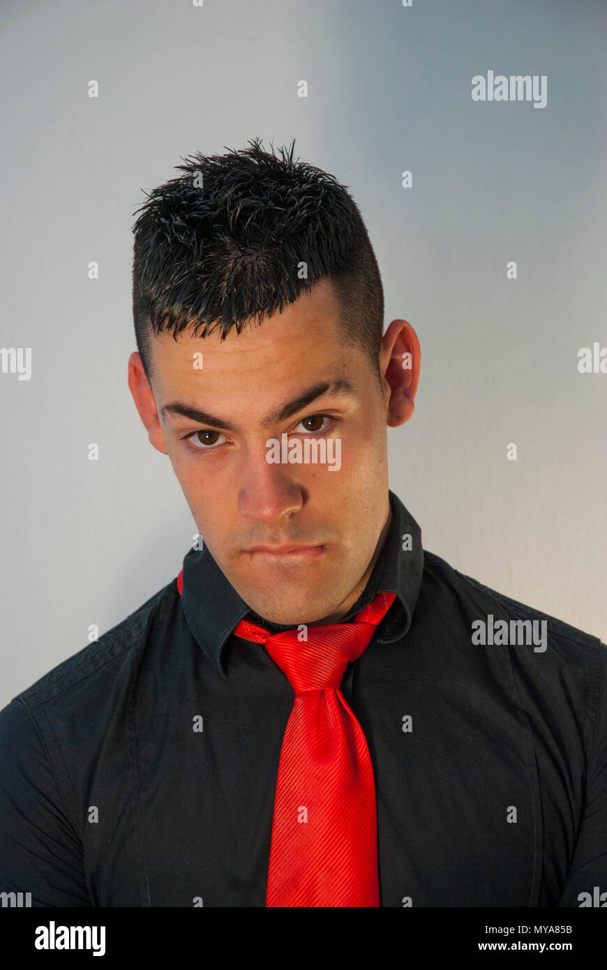 Man bitting his lip and looking at the camera Stock Photo - Alamy