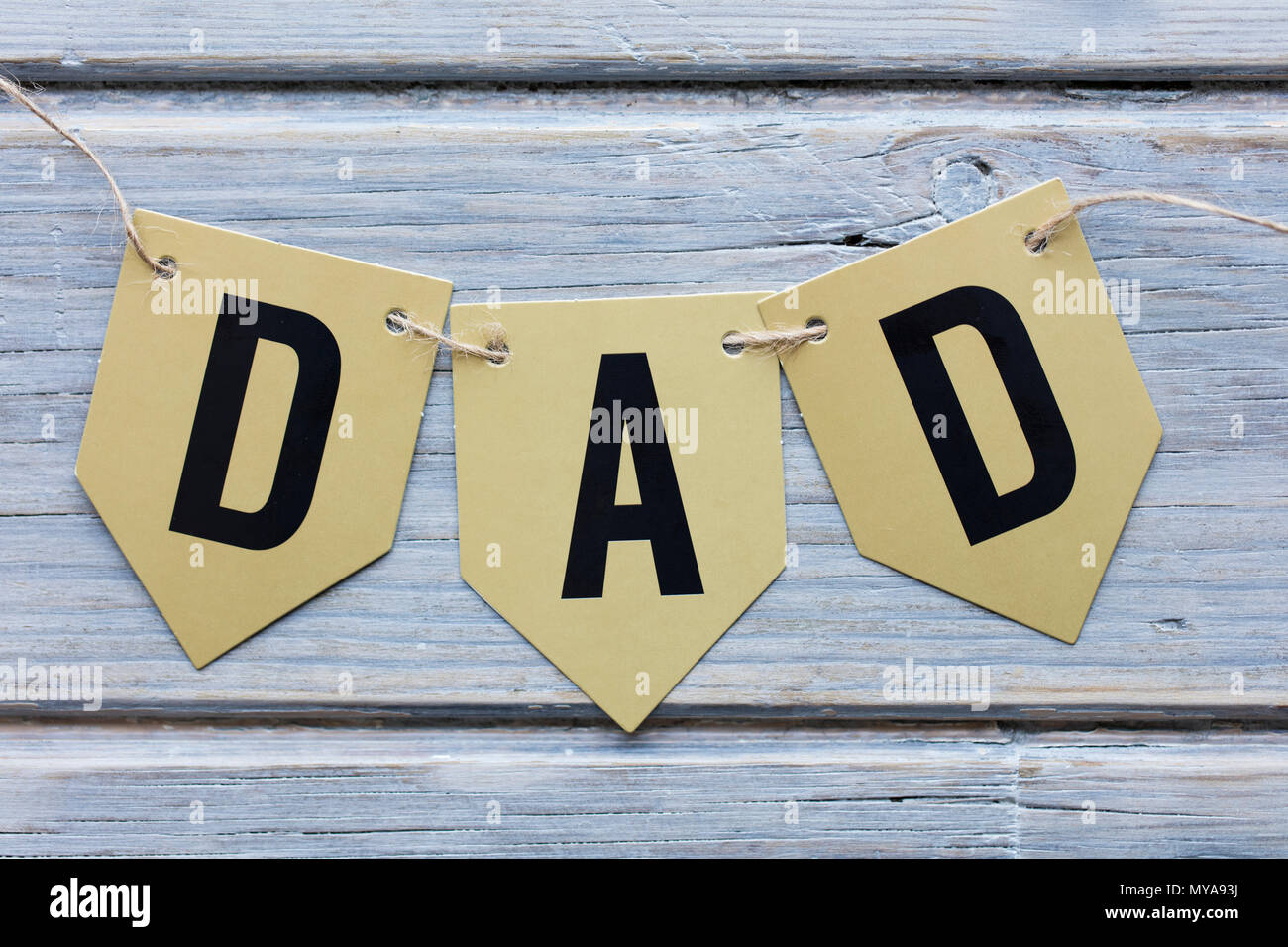 Father's Day background with a gold Dad banner on wood Stock Photo - Alamy