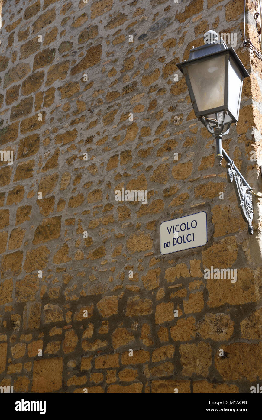 Glimpse of the ancient center of Orvieto, Italy. The houses are made ...