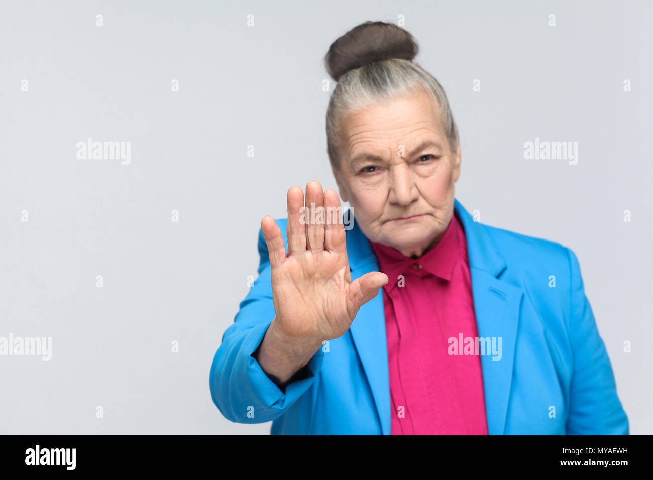 Stop sign woman senior hi-res stock photography and images - Alamy