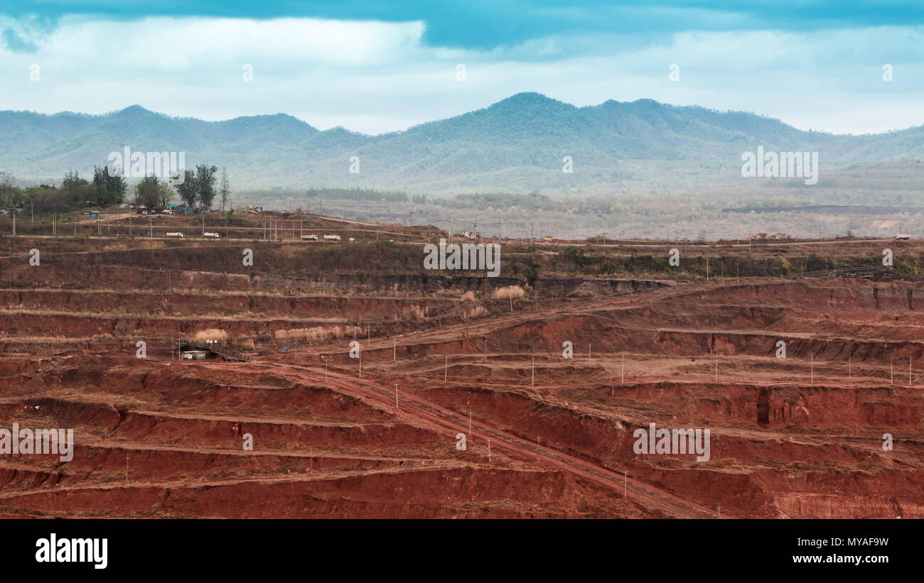 Ground layer of lignite mining and mining machinery. Many big trucks ...