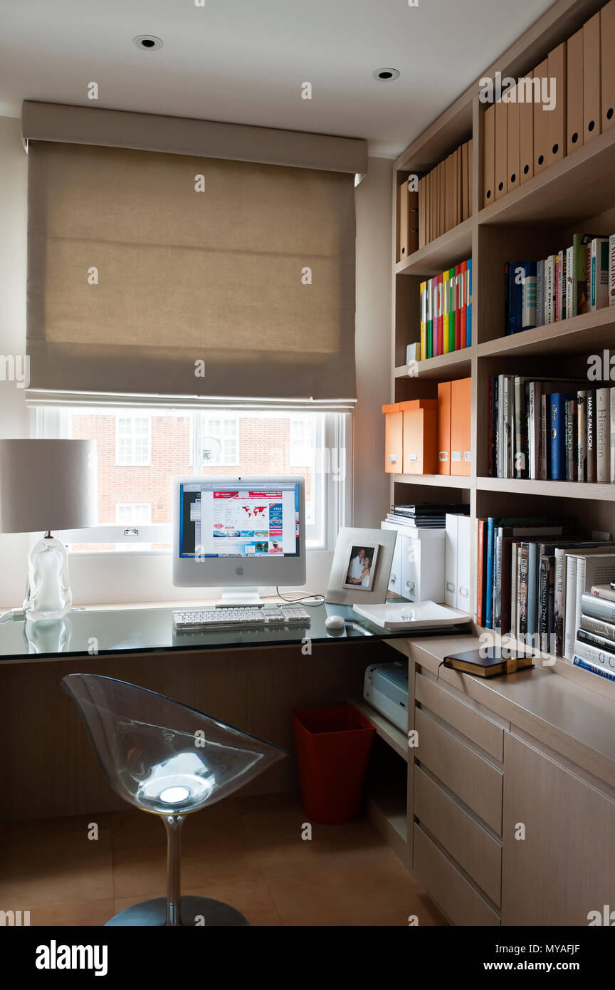 Bookshelf and stool in modern office Stock Photo - Alamy