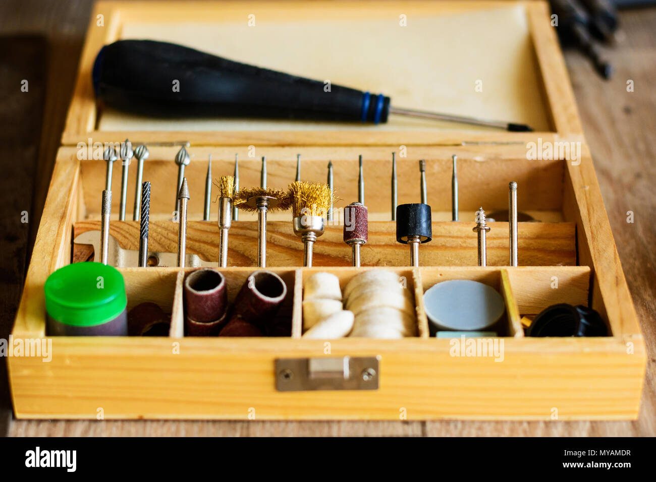 Set of small tools for grinding in a wooden case. In a carving workshop ...