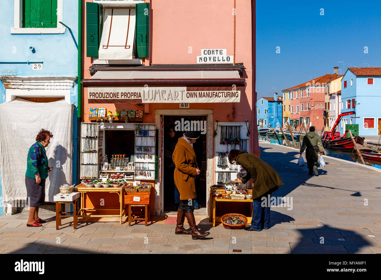 Tourists Buying Souvenirs From A Shop On Burano Island, Venice, Italy Stock Photo - Alamy