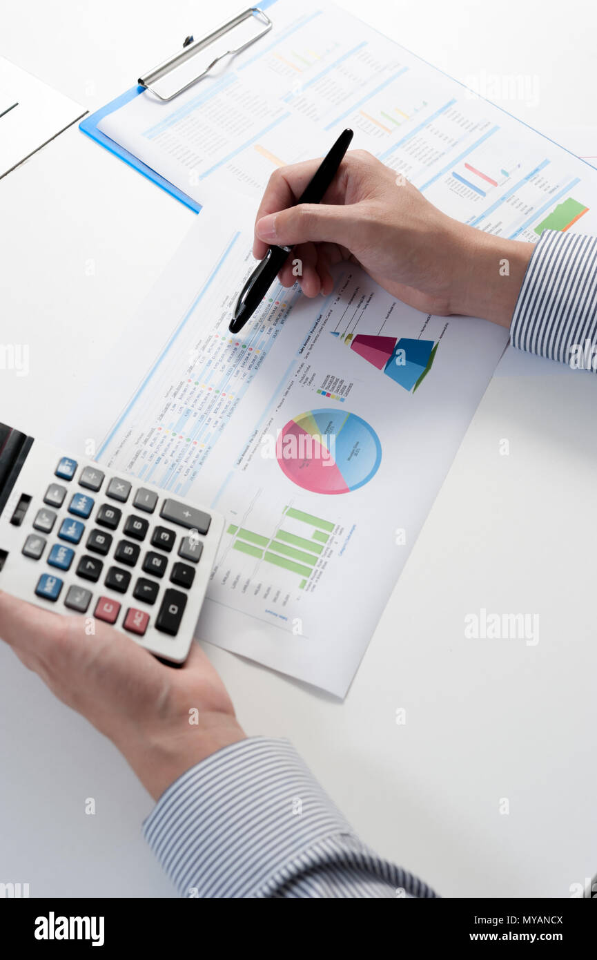 Businessman analyzing report, business performance concept Stock Photo ... Businessman analyzing report, business performance concept Stock Photo ...