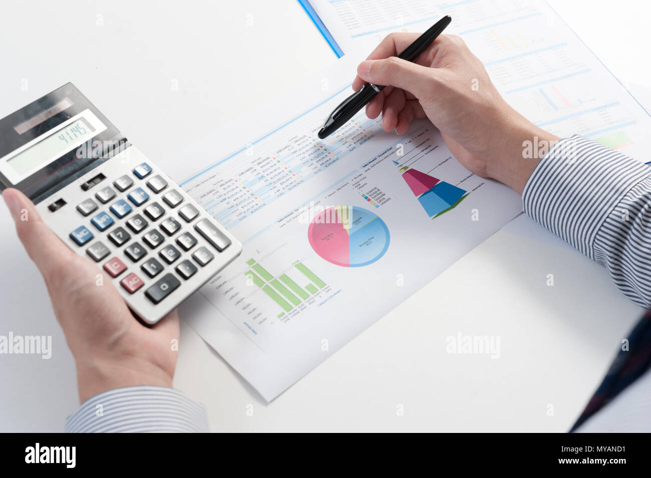 Businessman analyzing report, business performance concept Stock Photo ... Businessman analyzing report, business performance concept Stock Photo ...