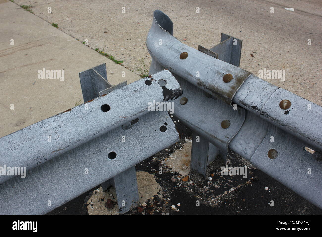 Two corrugated steel guardrails meet at a corner Stock Photo - Alamy