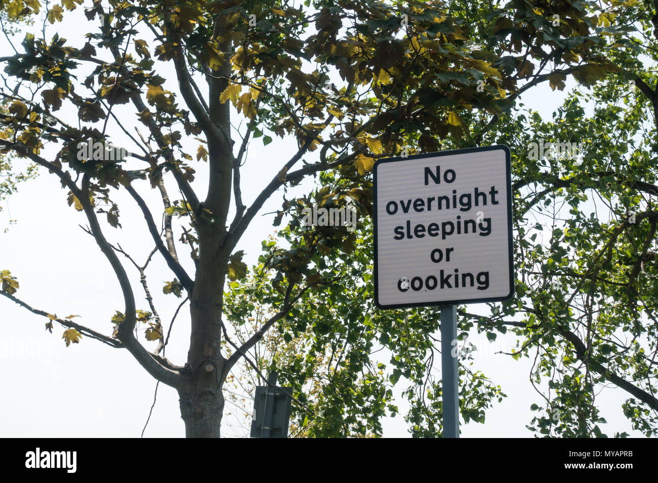 No overnight sleeping or cooking warning sign in a car park in Poole ...