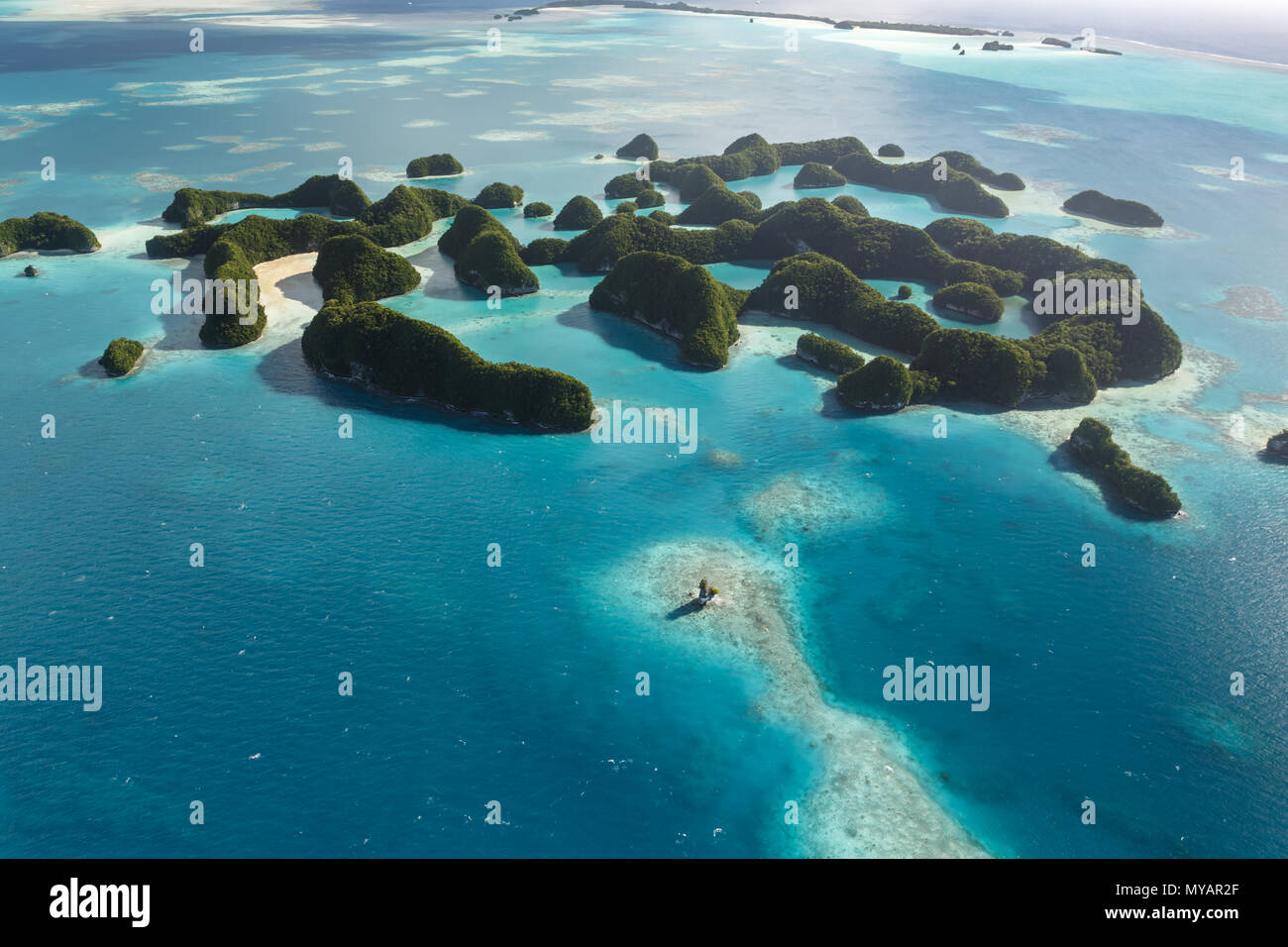 Aerial view of coral reefs, coral atolls, and islands surrounded by the ...