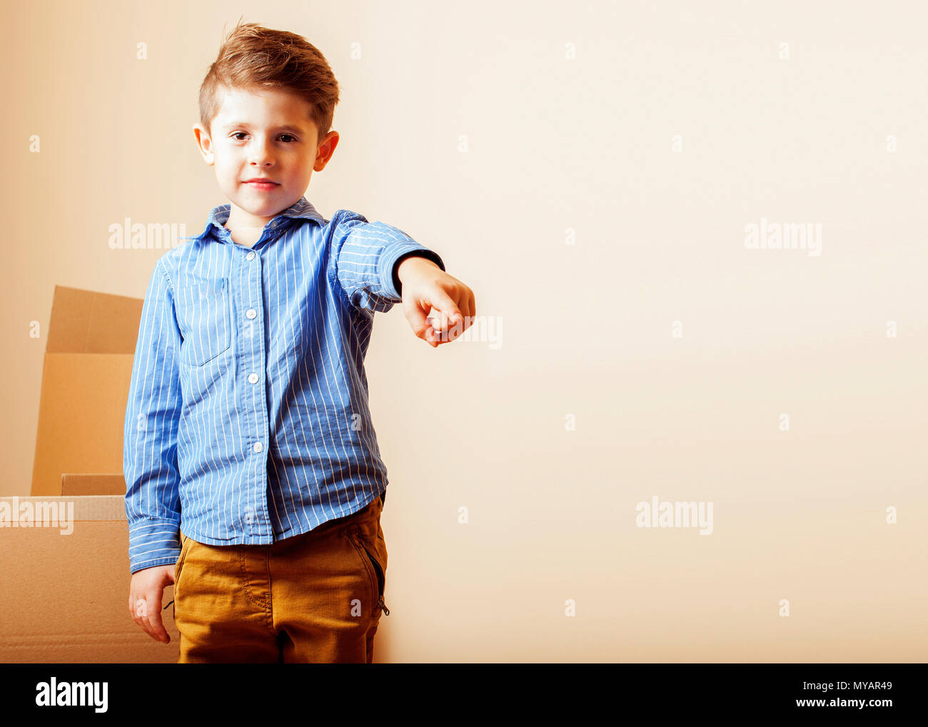 little cute boy in empty room, remoove to new house. home alone Stock ...