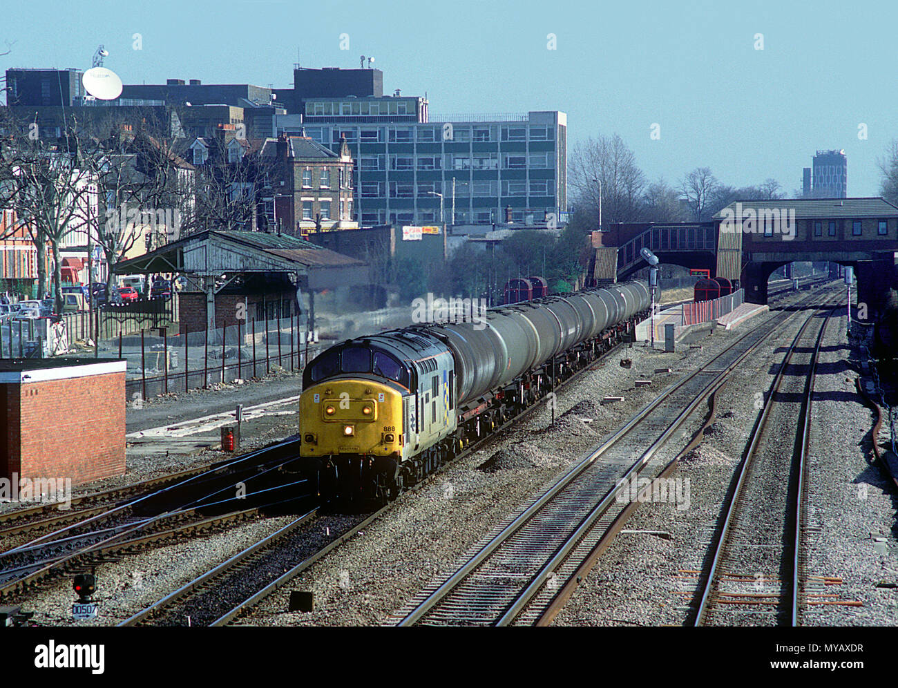 A class 37 diesel locomotive number 37888 "Petrolea" heads west with a ...