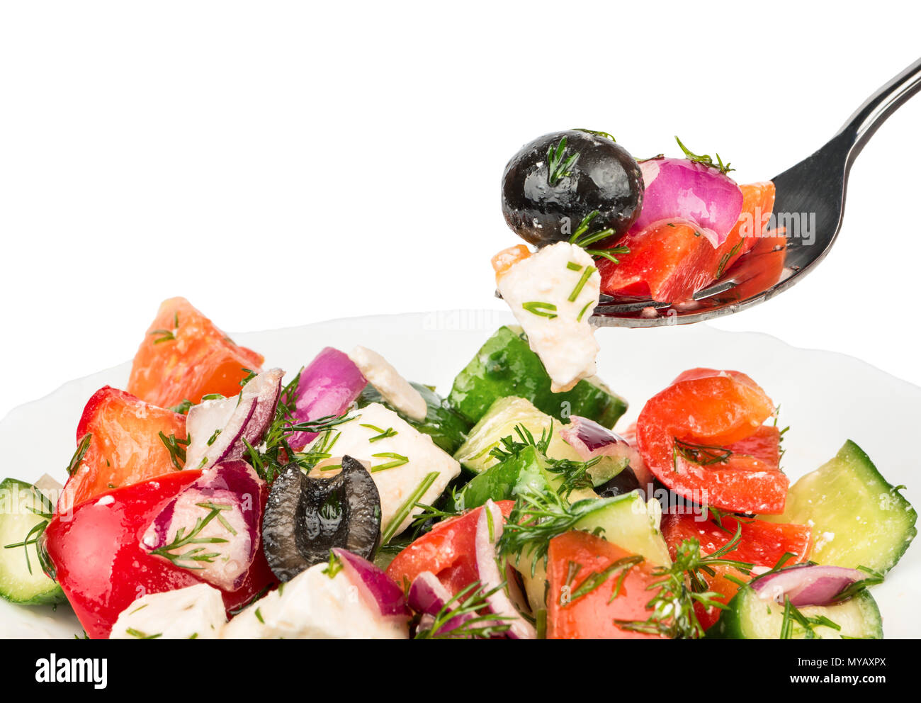 Fork with fresh Greek salad on white background Stock Photo - Alamy