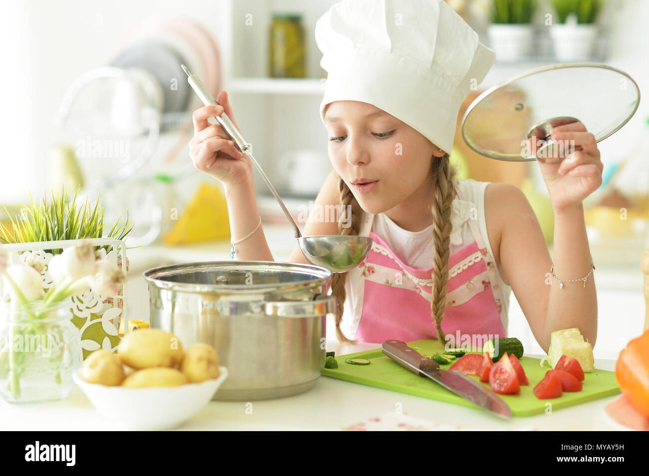 girl on the kitchen cook Stock Photo - Alamy