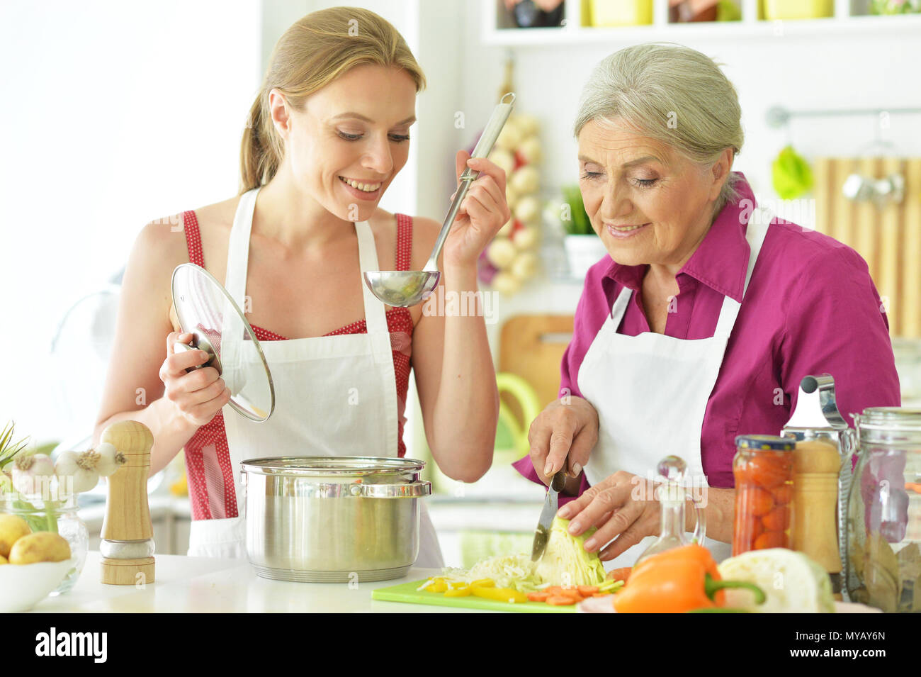Mom and daughter cook Stock Photo - Alamy