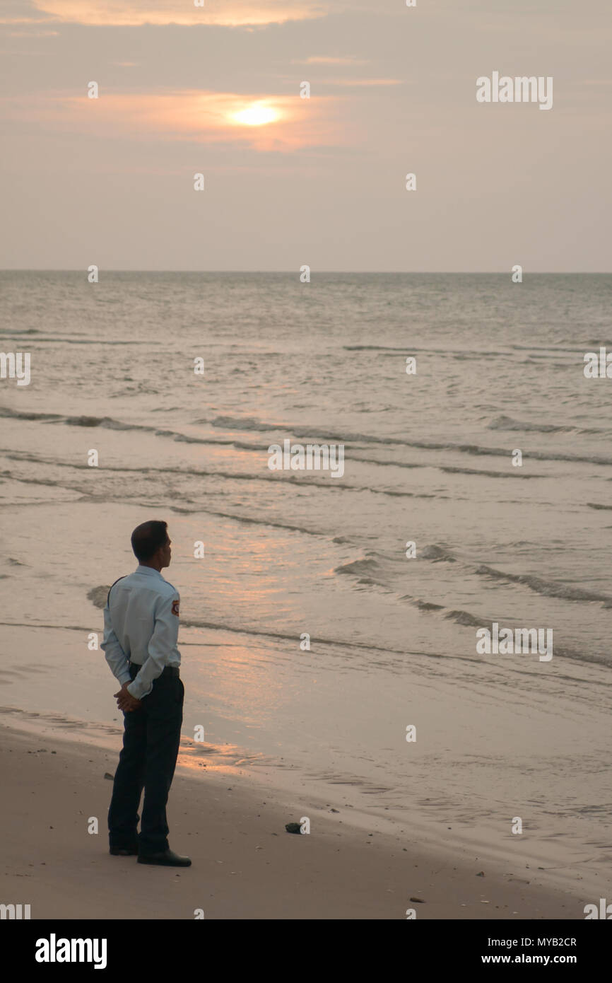A security guard of the hotel stand by the sea Stock Photo - Alamy