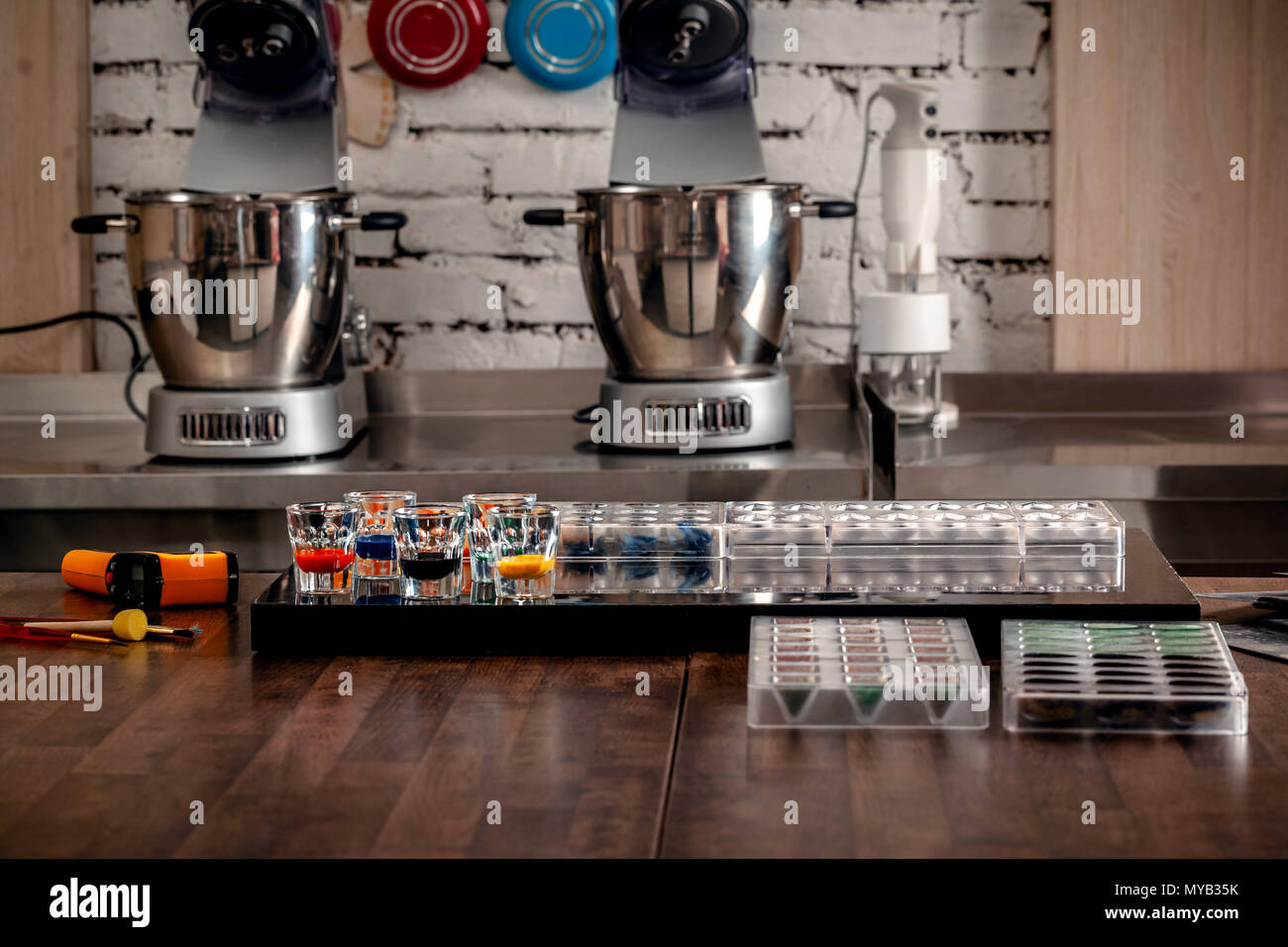 Confectionery and cooking tools for sweets on wooden table. Plastic ...