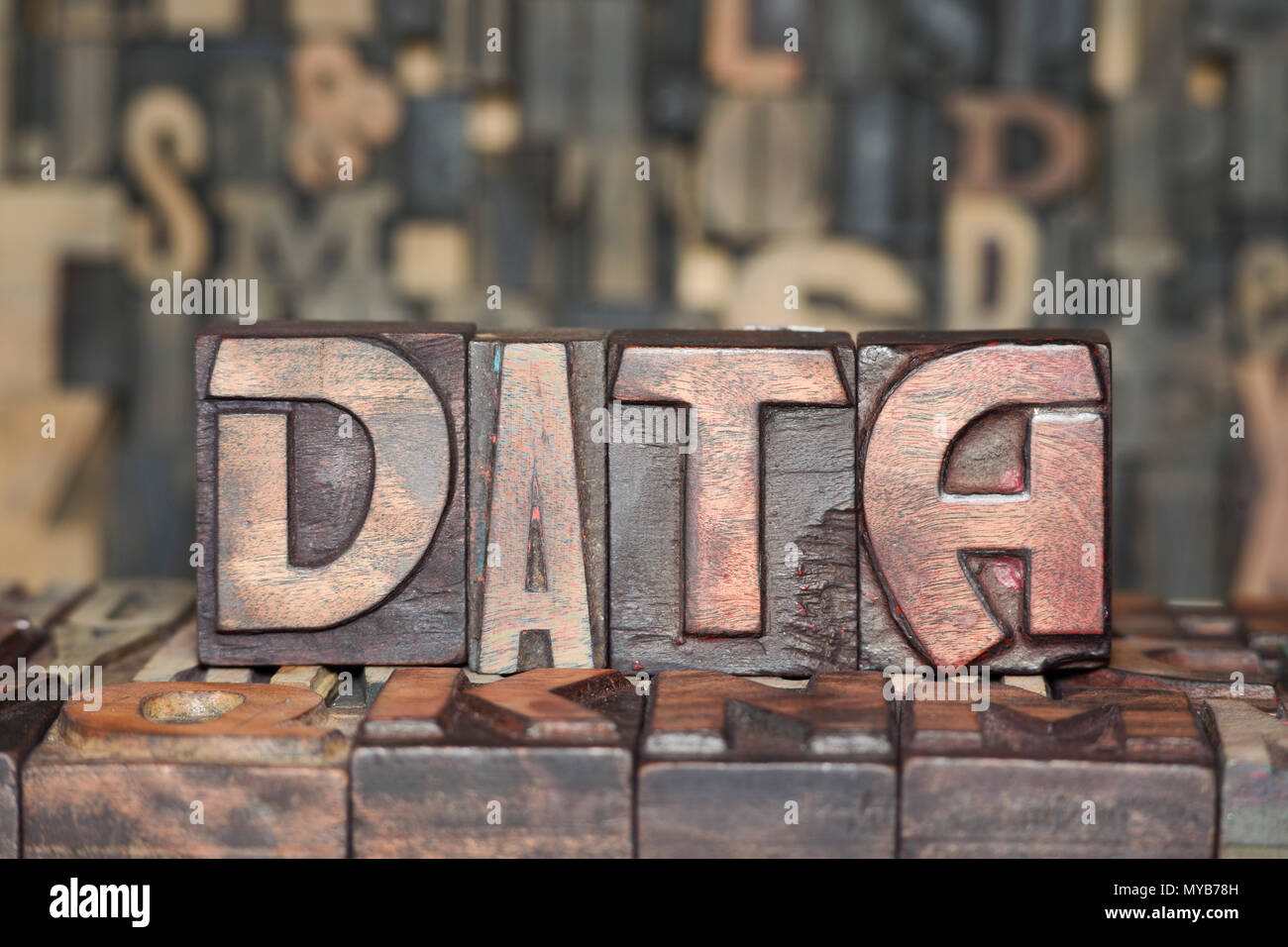 DATA word made from wooden letterpress blocks on many different letters ...