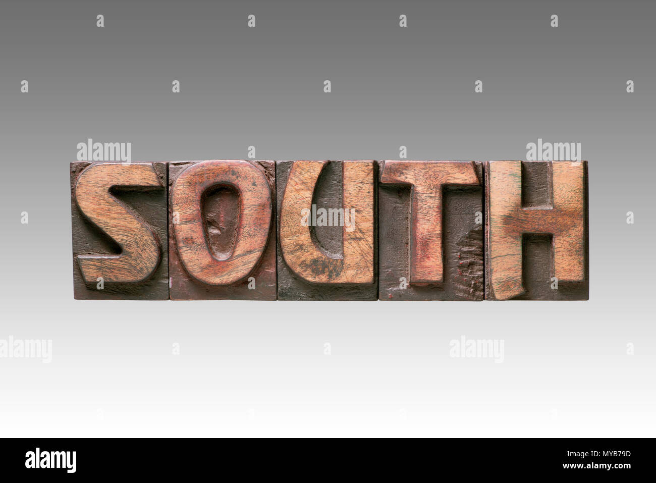 South word assembled from vintage wooden typography letters isolated on ...