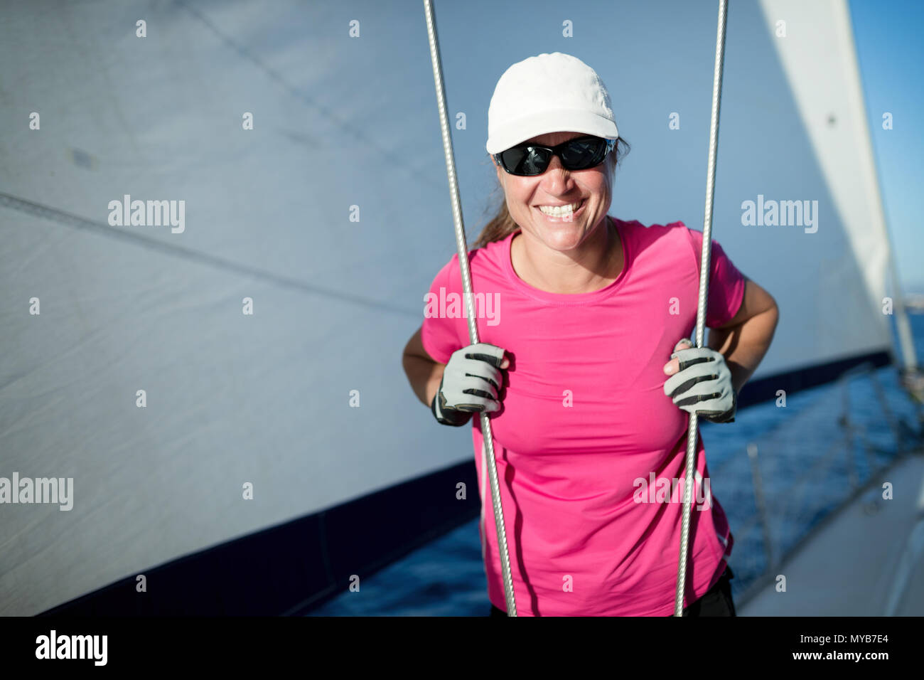 Happy strong woman sailing with her boat Stock Photo - Alamy