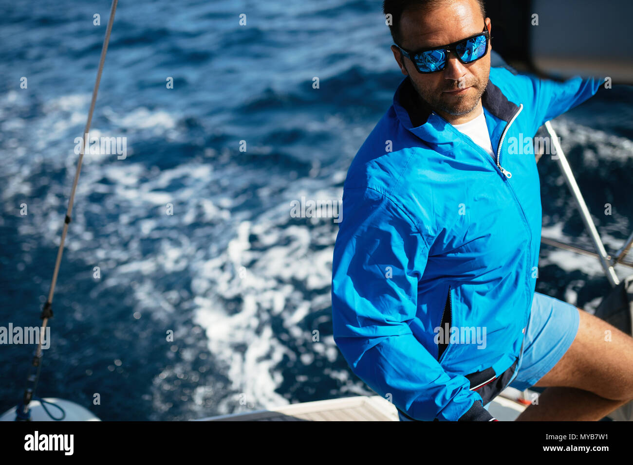 Handsome strong man sailing with his boat Stock Photo - Alamy